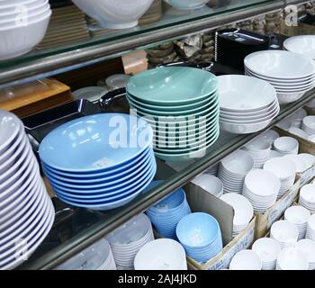 Stacks of plates in a shop Stock Photo - Alamy