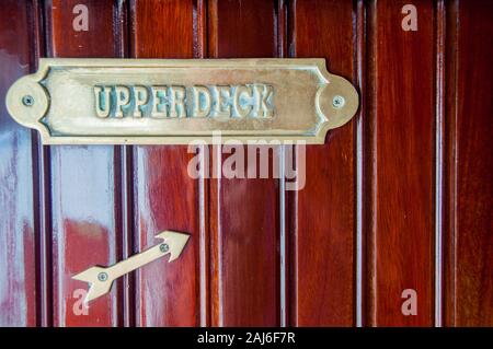 Sign pointing to the upper deck on a cruise ship Stock Photo - Alamy