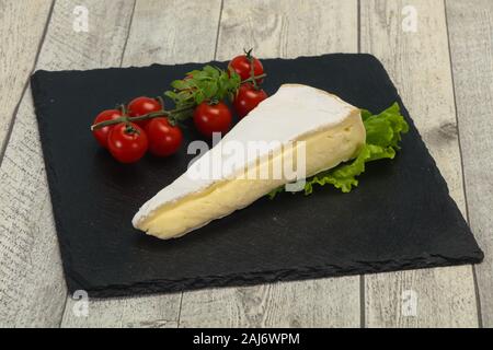 Brie cheese triangle served salad leaves Stock Photo - Alamy