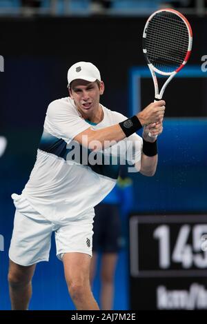 Cameron Norrie, of Great Britain, returns a shot to Francisco Comesana ...