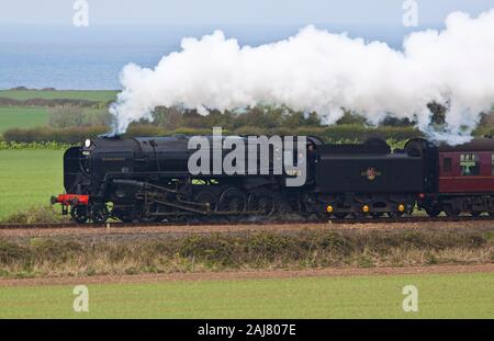 The British Railways Standard Class 9F steam locomotive pulls a train ...