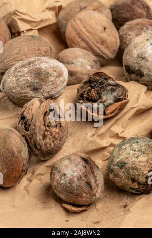 some mouldy unpleasant walnuts as a background Stock Photo - Alamy
