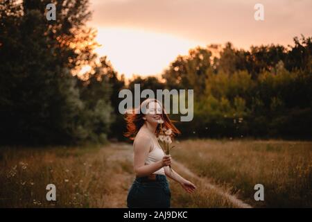 Scared young woman running away in the dark looking over shoulder Stock ...