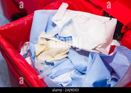 Biological risk waste disposed of in the red trash bag at a operating ...