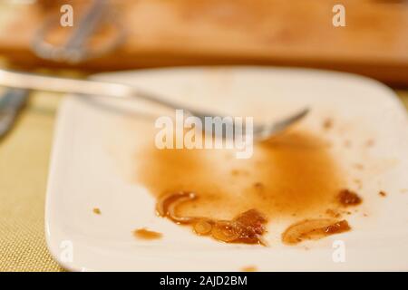 food stain left after eat on dish in white background Stock Photo - Alamy