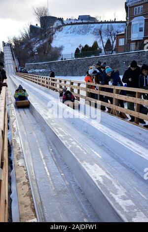 Traditional winter toboggan slide in Quebec City with Fairmont Le ...