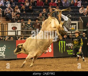 Professional bull rider Brady Fielder rides ”Chuck & Larry” during ...