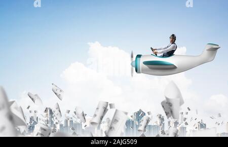 Screaming pilot sitting in paper plane Stock Photo - Alamy