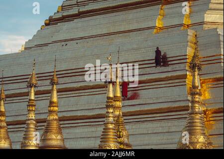 monks walking on gold temple in Myanmar Stock Photo - Alamy