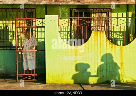 Old green door of a poor Spanish house Stock Photo - Alamy