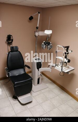 An optometry chair and exam equipment Stock Photo - Alamy