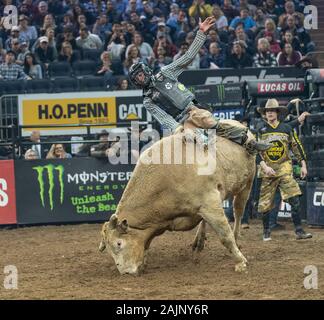 Professional bull rider Brady Fielder rides ”Chuck & Larry” during ...