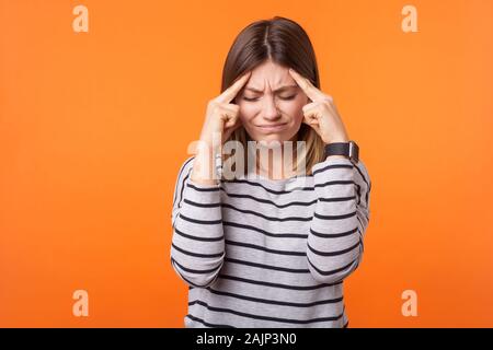 woman in striped t-shirt headache health problems stress Stock Photo ...