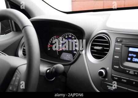 Modern car illuminated dashboard closeup, tachometer Stock Photo ...