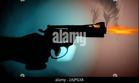 Man holding hand gun at firing range, portrait Stock Photo - Alamy