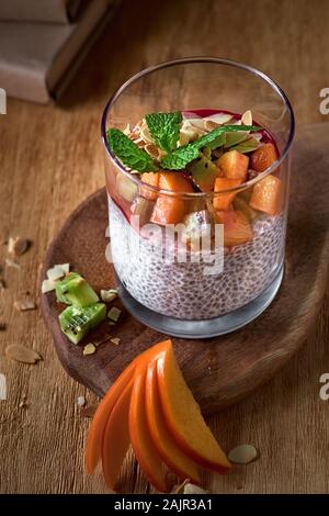 Passion fruit mousse on wooden background Stock Photo - Alamy