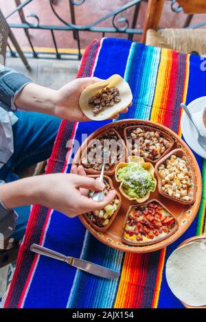 mexican plate with different meat and guacamole Stock Photo - Alamy