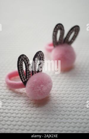 Collection of colorful hair bow accessory displayed on rack with varied ...