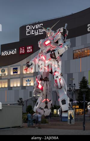 A full-scale Gundam statue from the series Mobile Suit Gundam Unicorn ...