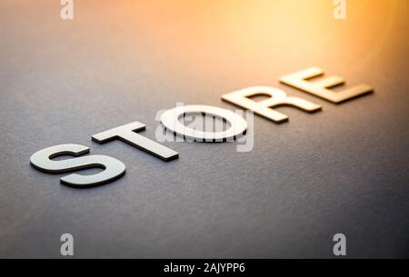 Word store written with white solid letters on a board. Word store ...