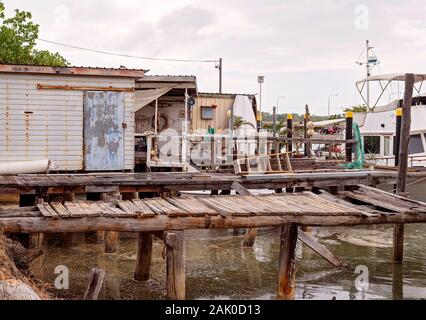 Broken hut on wooden pier Stock Photo - Alamy