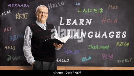 FRENCH LANGUAGE CLASS Male teacher teaching french language to teenage ...