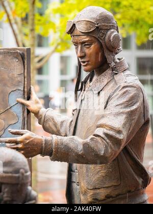 bronze statue of a group of military pilots during a mission briefing ...