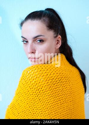 Young woman with yellow pullover, cool look Stock Photo - Alamy