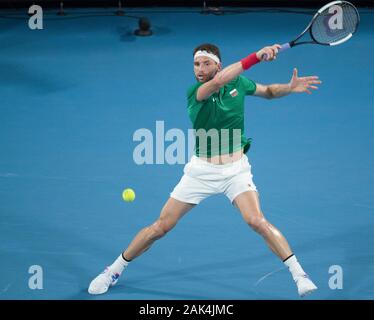 David Goffin of Belgium returns a shot to Malek Jaziri of Tunisia in ...