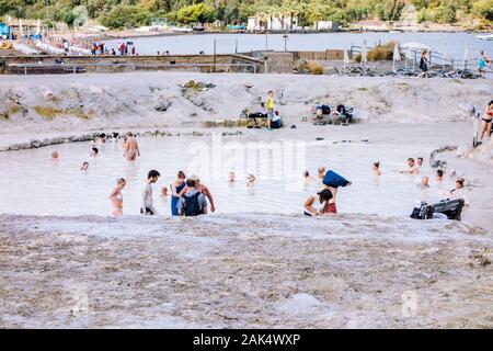 People bathing in volcanic mud on the island of Vulcano, Aeolian ...
