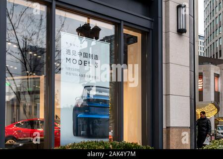 An advertising poster for the domestically-manufactured Tesla Model 3 ...