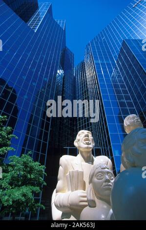 Illuminated Crowd Sculpture by Raymond Masson in front of a skyscraper ...