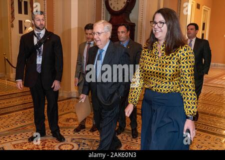 Sen. Mitch McConnell (R-Ky.) walks with a security guard at the U.S ...