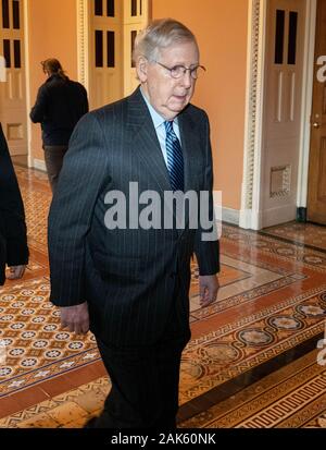 Sen. Mitch McConnell (R-Ky.) walks with a security guard at the U.S ...