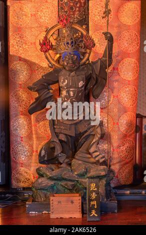 Japanese ancient statue of demon in stone in forest park at day Stock ...