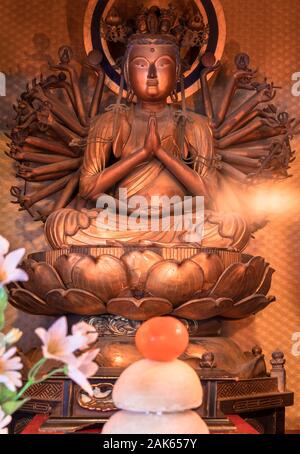 Golden wooden statue depicting the bodhisattva Sente Kannon with ...