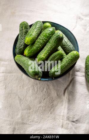 Fresh local cucumbers in bowl, top view healthy food Stock Photo - Alamy
