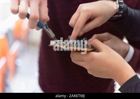 Industrial robotics teamwork on working with CNC lathe machine in smart ...