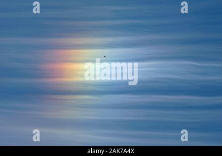 A rainbow spot, or sundog, in the sky above Brancaster, Norfolk Stock ...