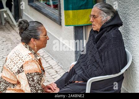 old women in typical black clothes in Nazare, Portugal Stock Photo - Alamy