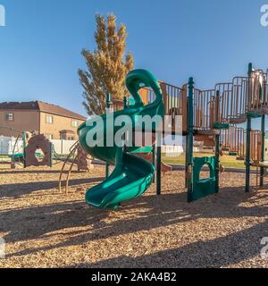 Square Assorted shapes of slides in a kids playground Stock Photo - Alamy