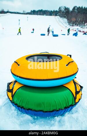 snow tubing rings close up. hill on background Stock Photo - Alamy