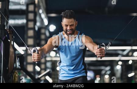 shouting strong sport man training with dumbbell. strong sport man ...