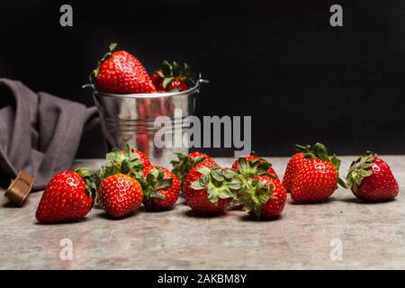 Delicious strawberries in a galvanized bucket on a marble table Stock ...