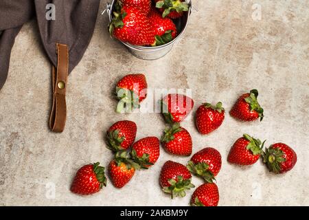 Delicious strawberries in a galvanized bucket on a marble table Stock ...
