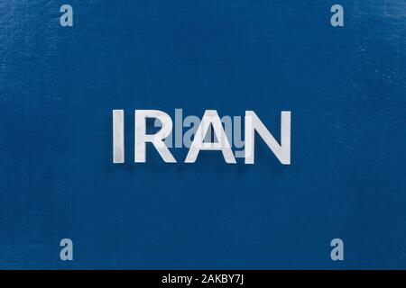 the word sanctions laid with silver metal letters on russian tricolor ...