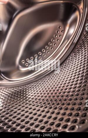 Steel drum of washing machine, textured background Stock Photo - Alamy