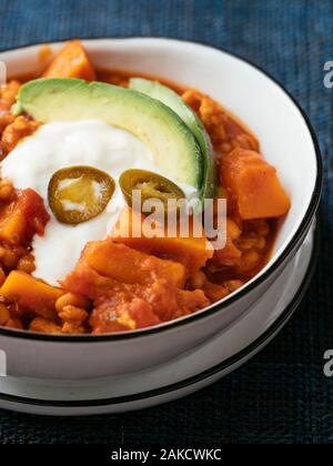 Home made vegan chili with TVP on rice Stock Photo - Alamy