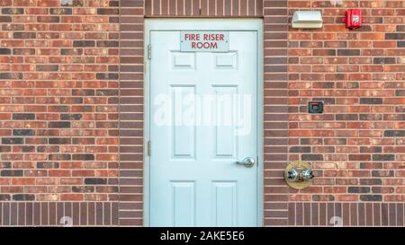 Fire Riser Room sign on the door leading to dedicated space for fire ...