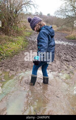 Girl Slipping in Mud Stock Photo - Alamy